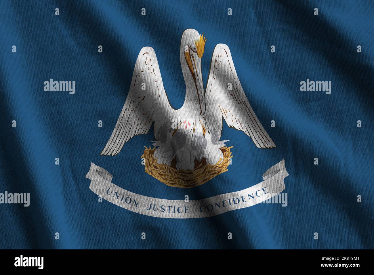 Louisiana US state flag with big folds waving close up under the studio ...