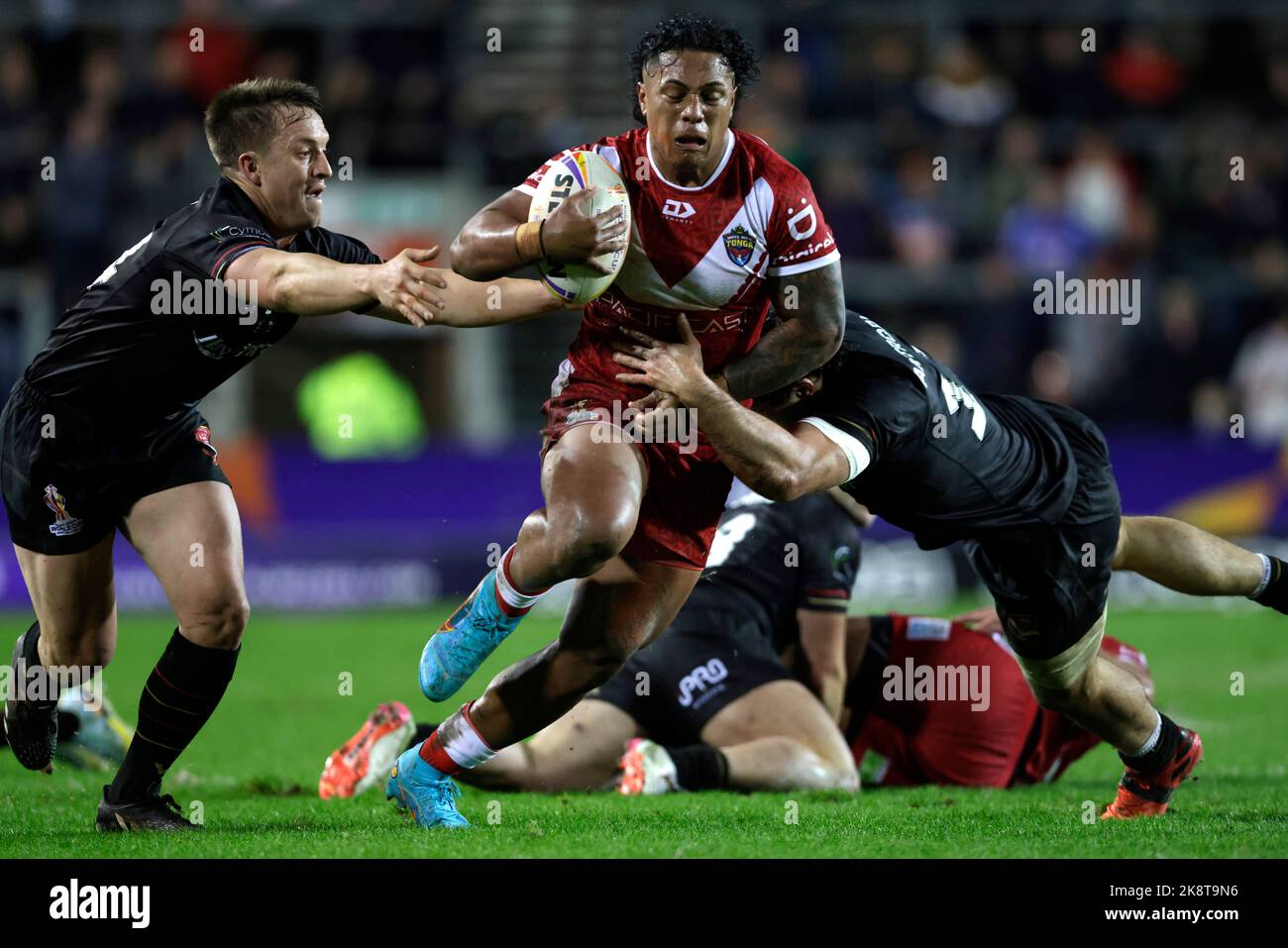 Tonga's Tesi Niu (centre) breaks clear with the ball during the Rugby ...