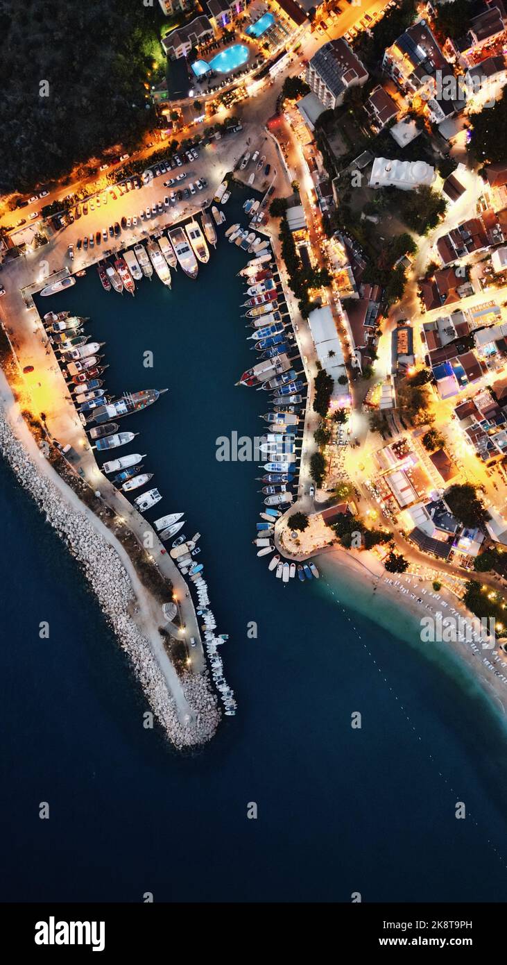 An aerial of Kalkan town at night on the Turkish Mediterranean coast ...