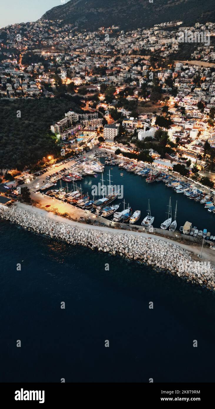An aerial of Kalkan town at night on the Turkish Mediterranean coast ...