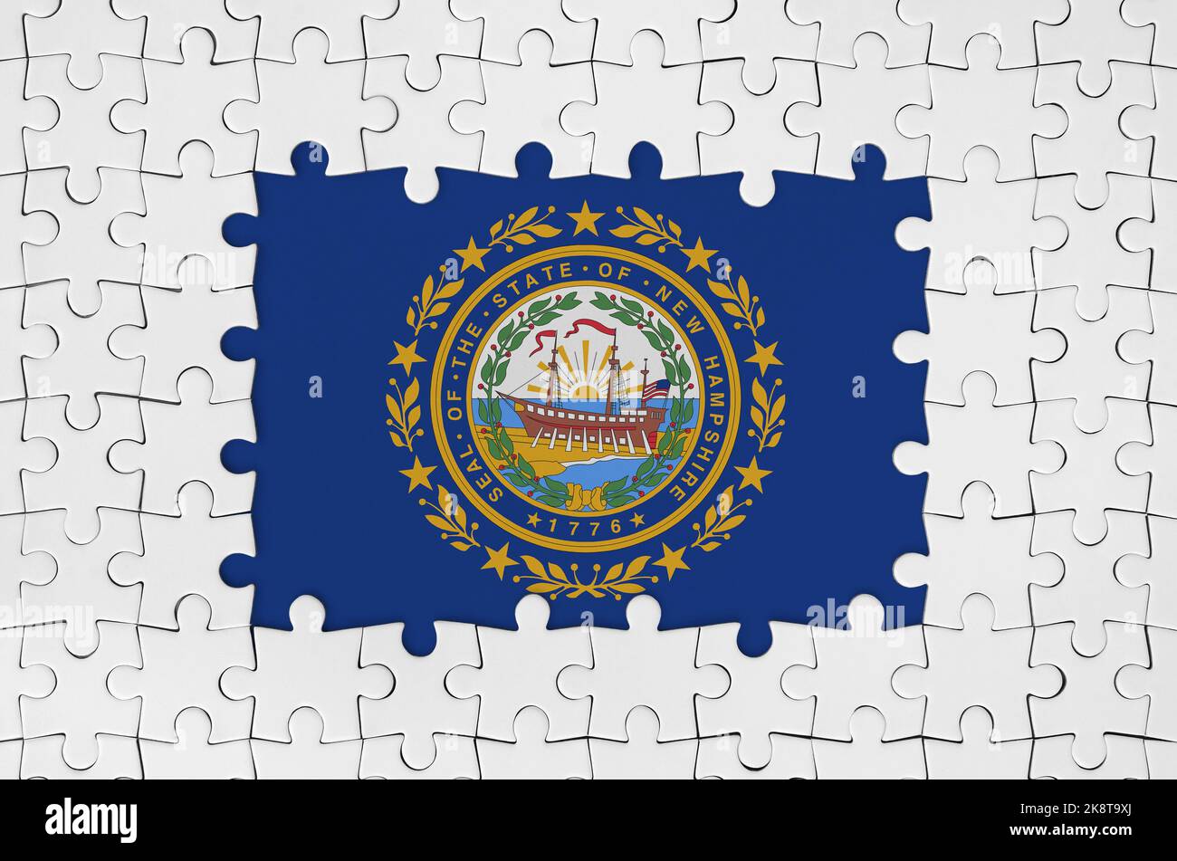 New Hampshire US state flag in frame of white puzzle pieces with ...