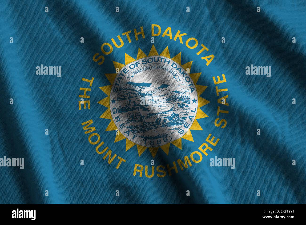 South Dakota US state flag with big folds waving close up under the ...