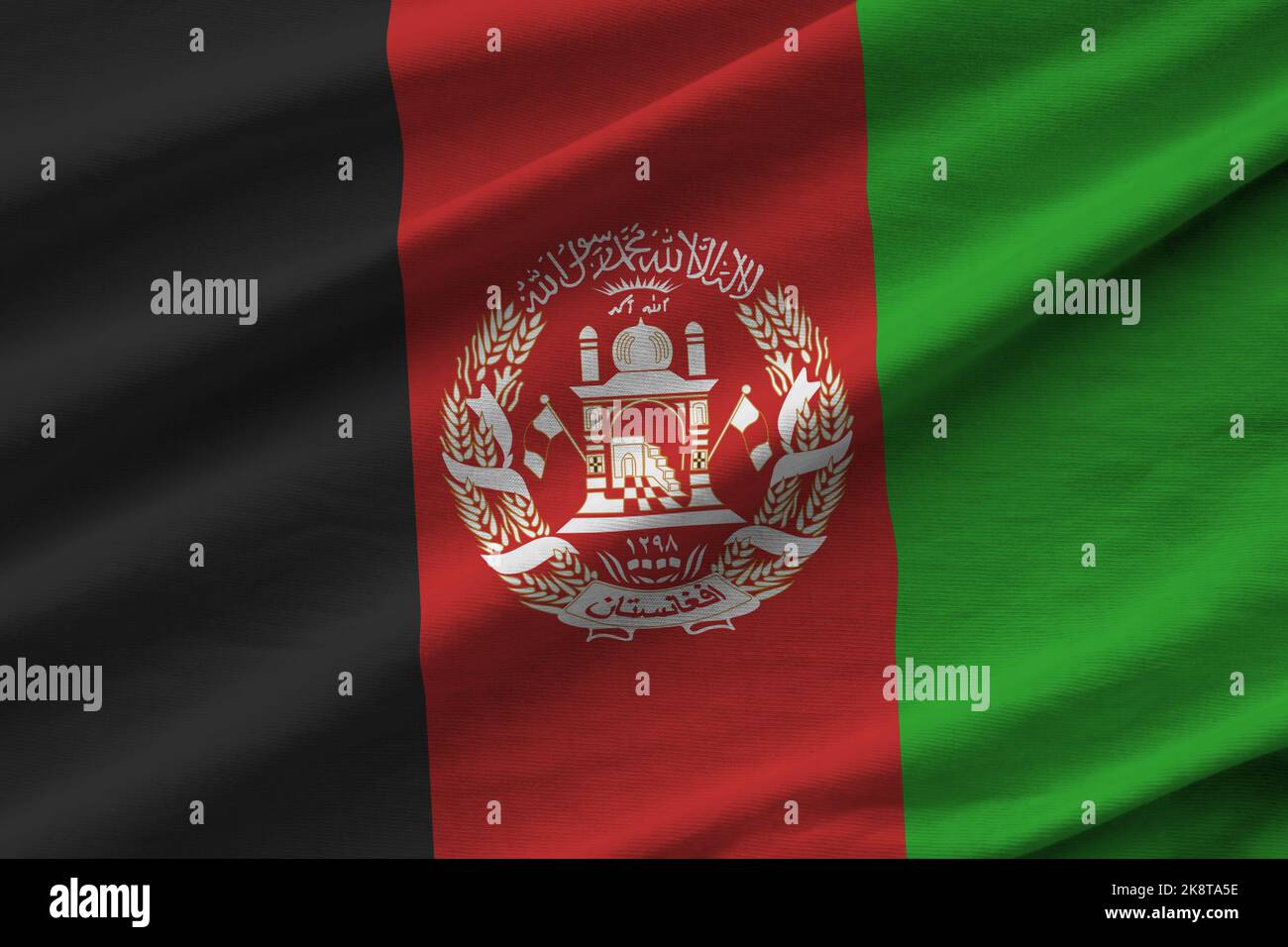 Afghanistan flag with big folds waving close up under the studio light ...