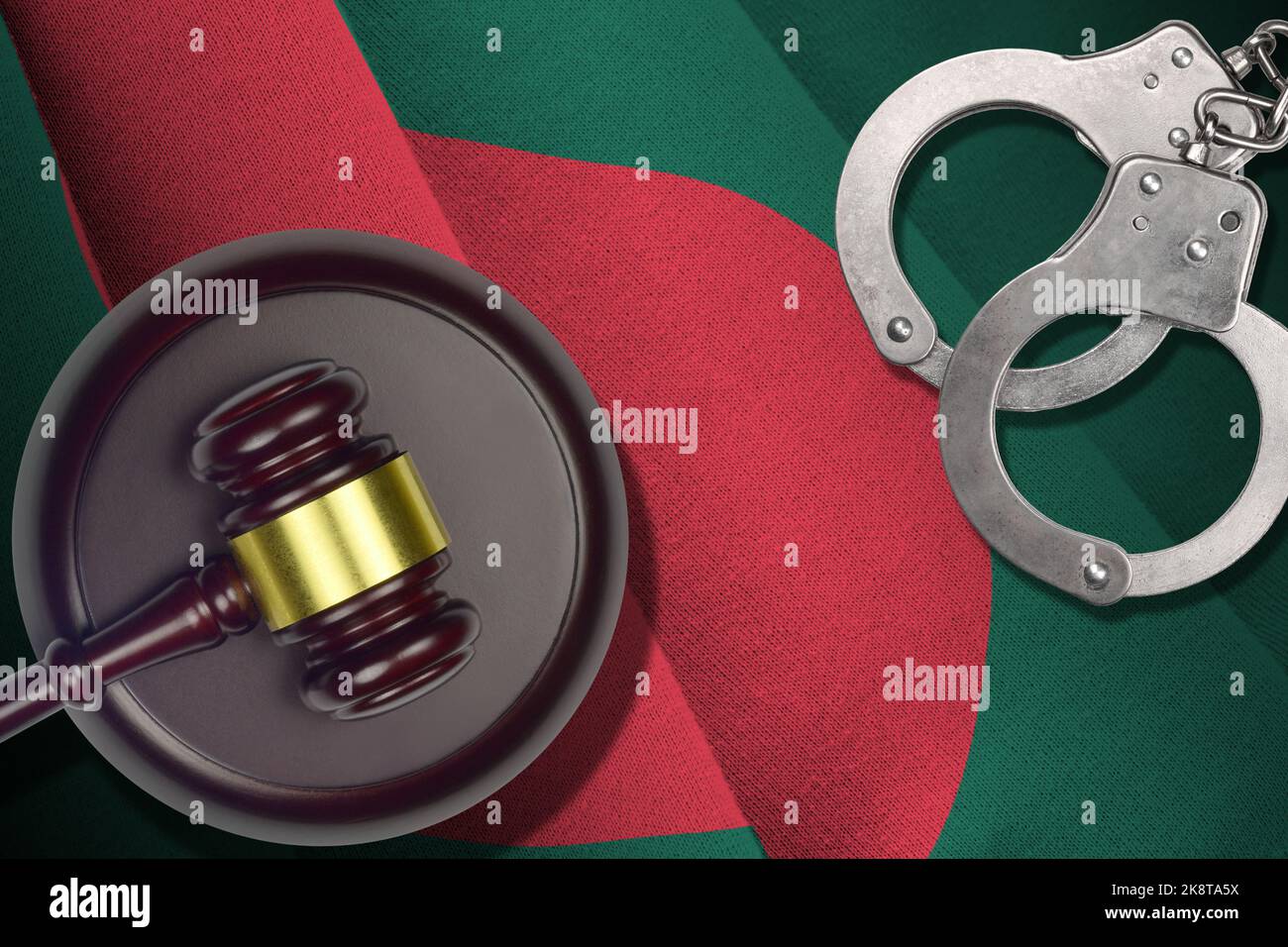 Bangladesh flag with judge mallet and handcuffs in dark room. Concept ...