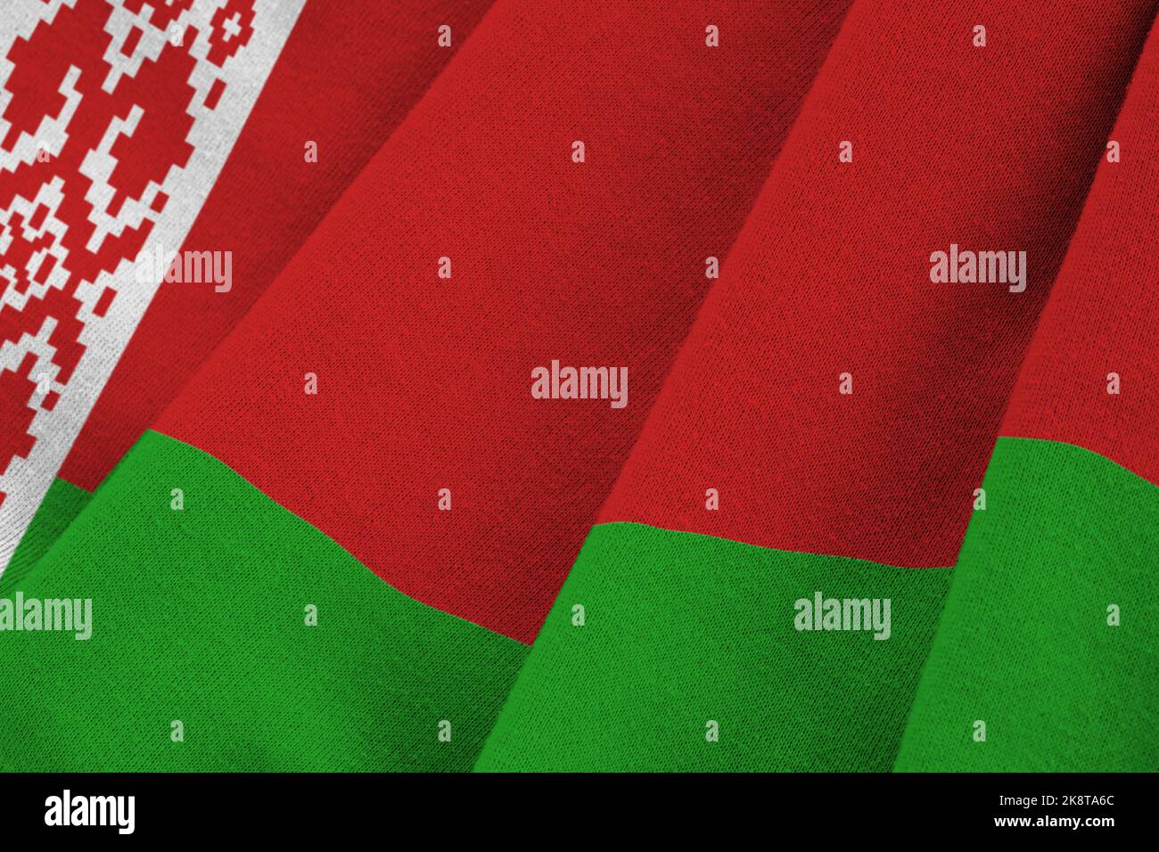 Belarus flag with big folds waving close up under the studio light ...