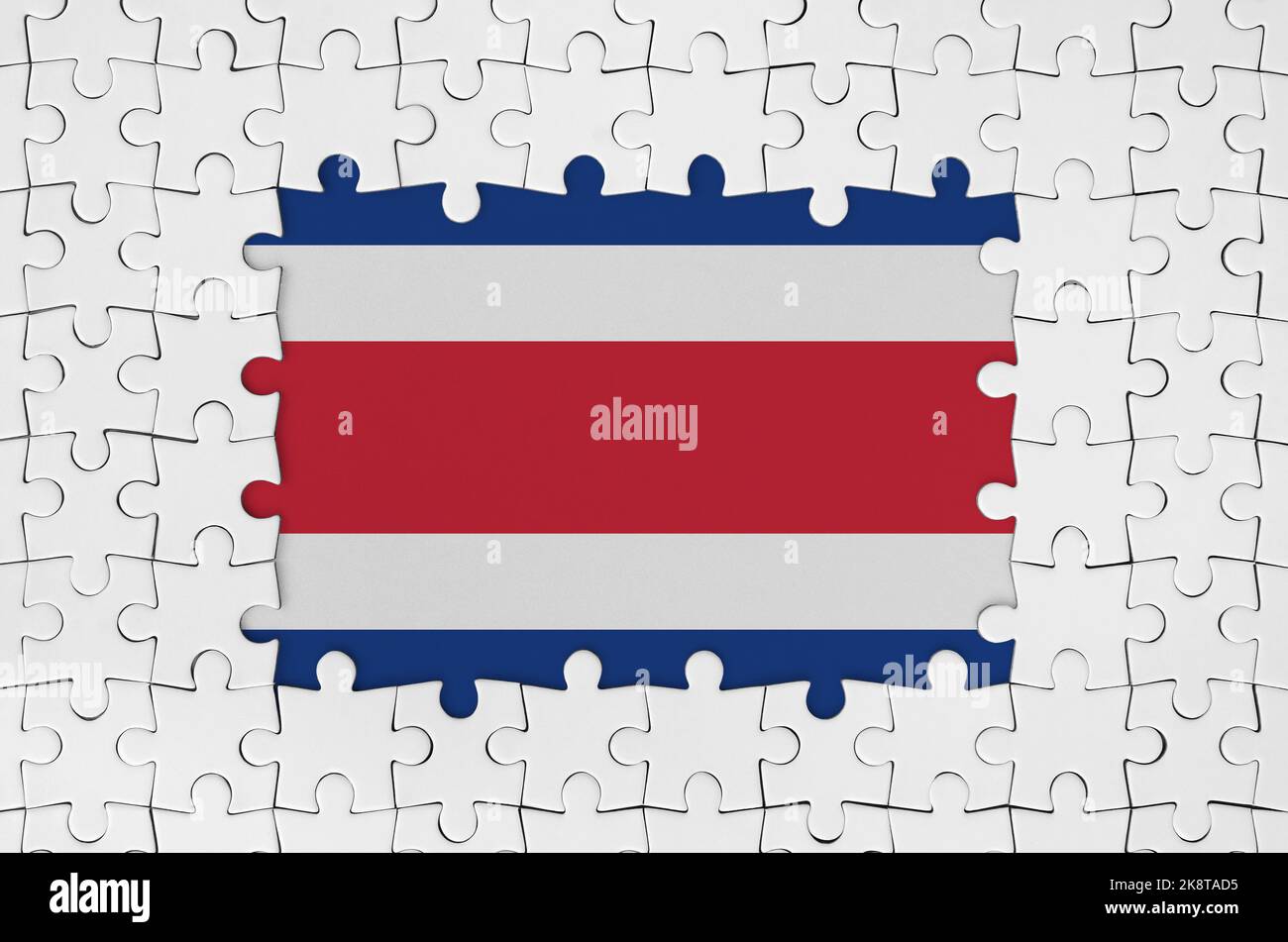 Costa Rica flag in frame of white puzzle pieces with missing central ...