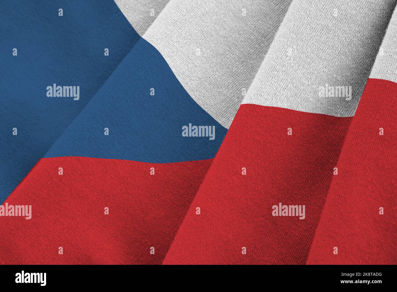 Czech flag with big folds waving close up under the studio light ...