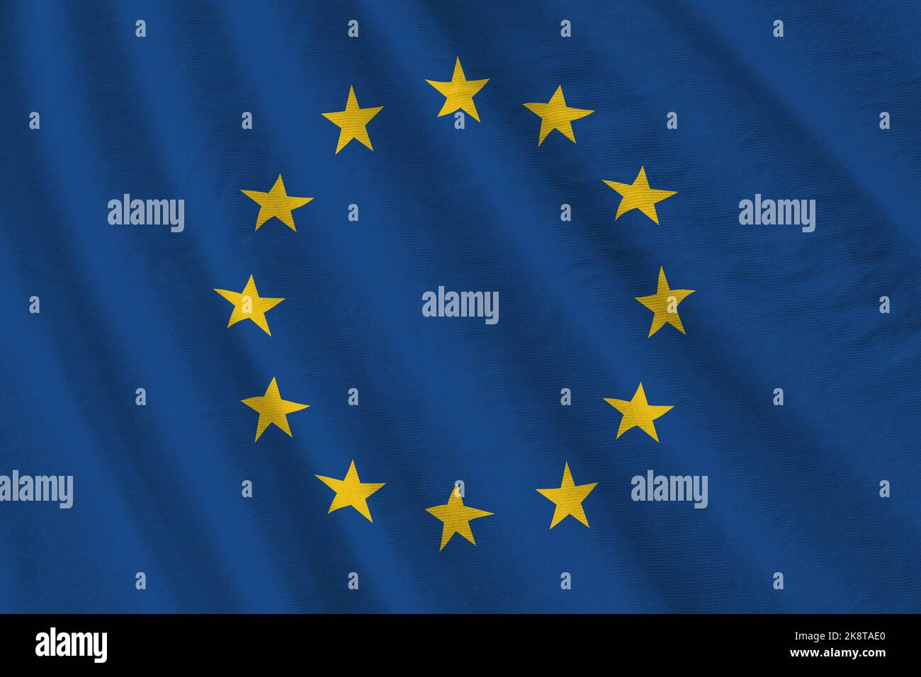 European union flag with big folds waving close up under the studio ...