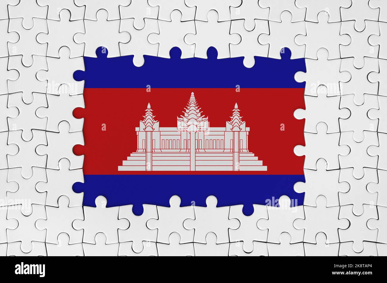 Cambodia flag in frame of white puzzle pieces with missing central ...