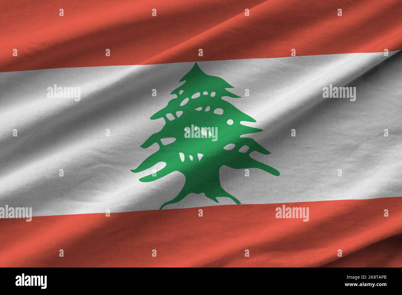 Lebanon flag with big folds waving close up under the studio light ...