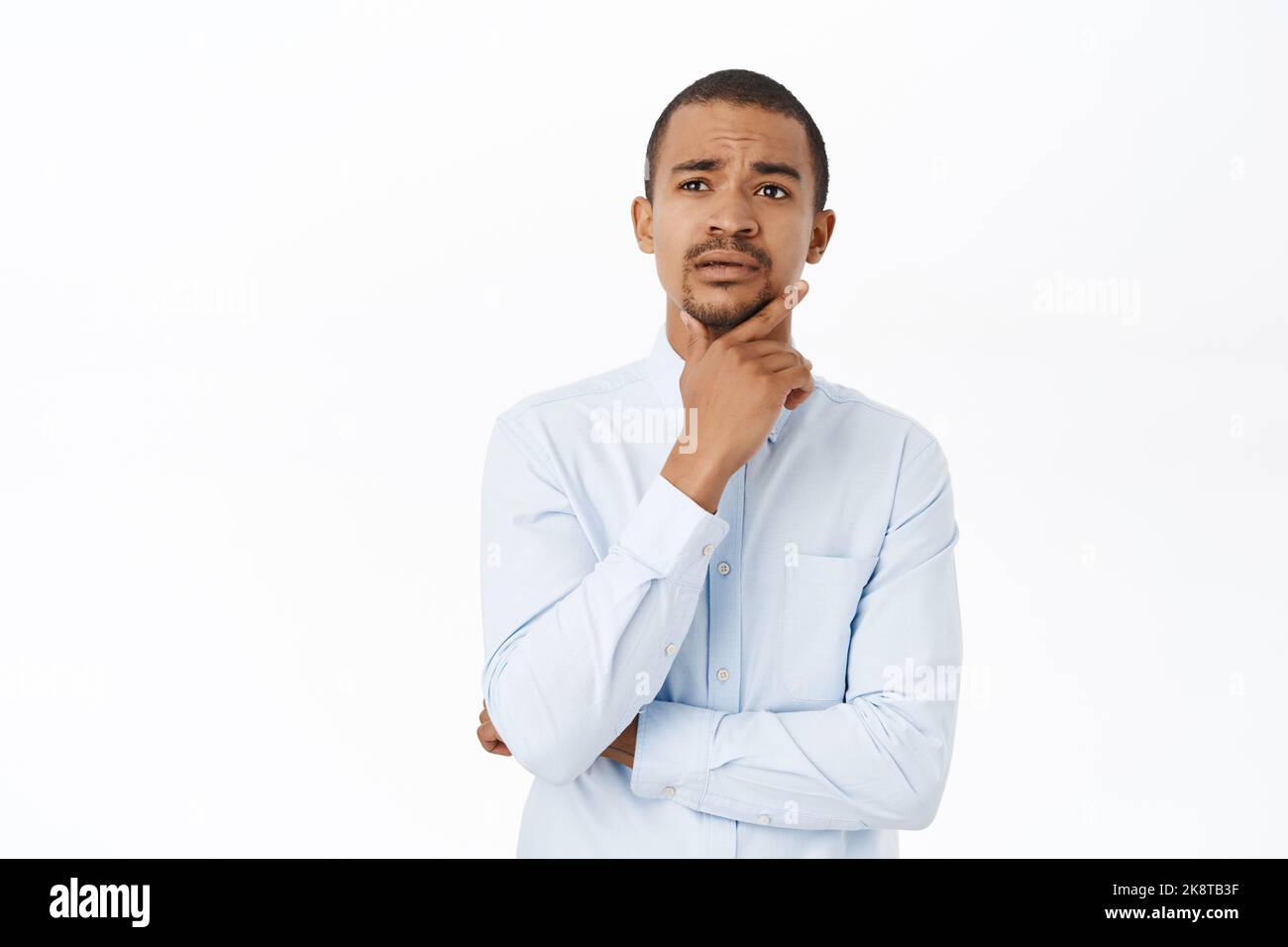 Thoughtful young manager making hi-res stock photography and images - Alamy
