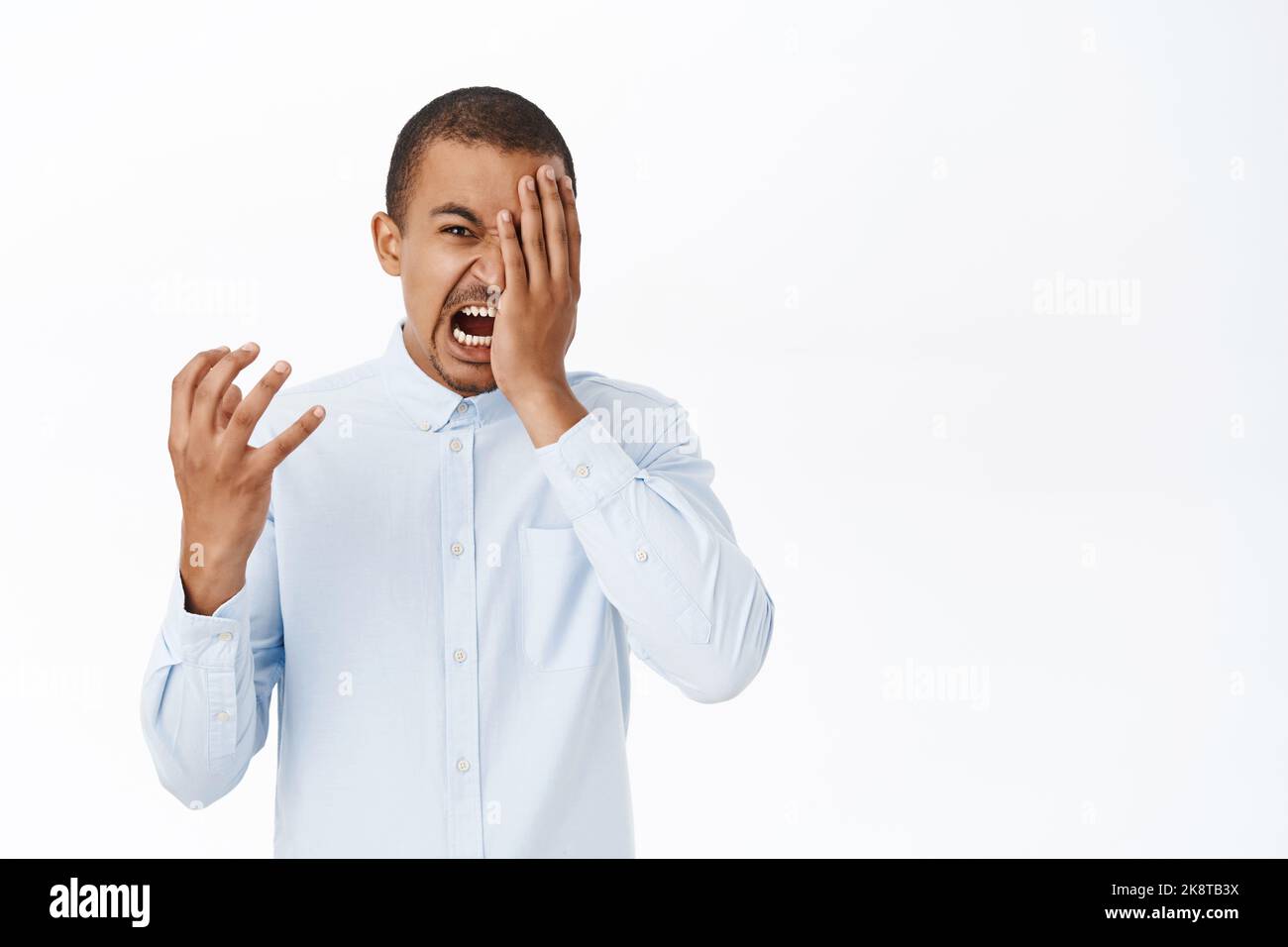 Angry man shaking from rage, shouting and screaming outraged, standing ...