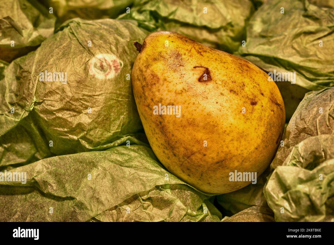 A closeup wrapped Bosc pears for sale at an outdoor market in Los ...