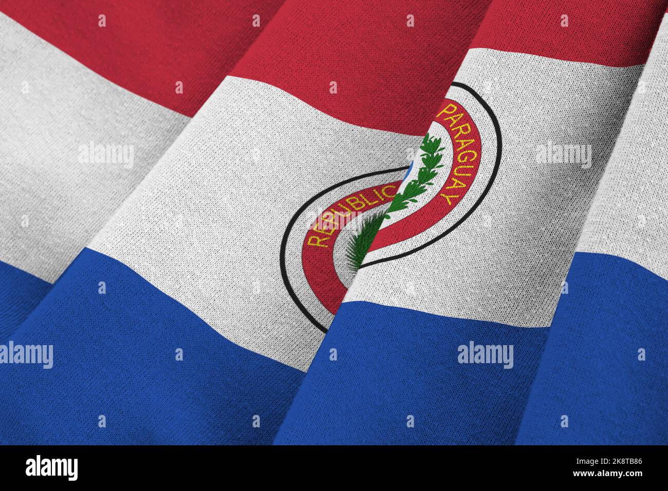 Paraguay flag with big folds waving close up under the studio light ...