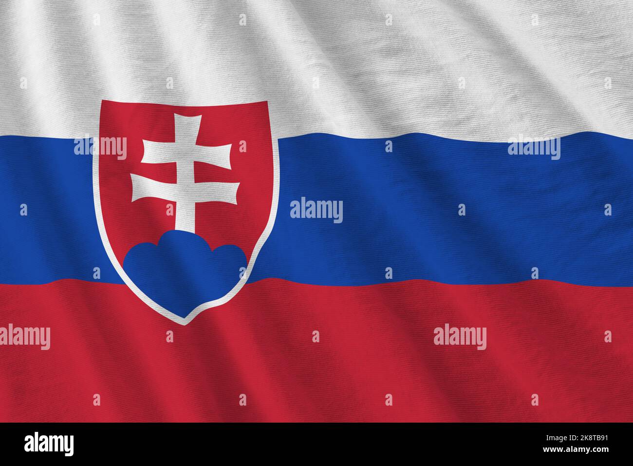 Slovakia flag with big folds waving close up under the studio light ...