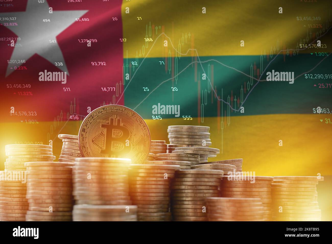Togo flag and big amount of golden bitcoin coins and trading platform ...