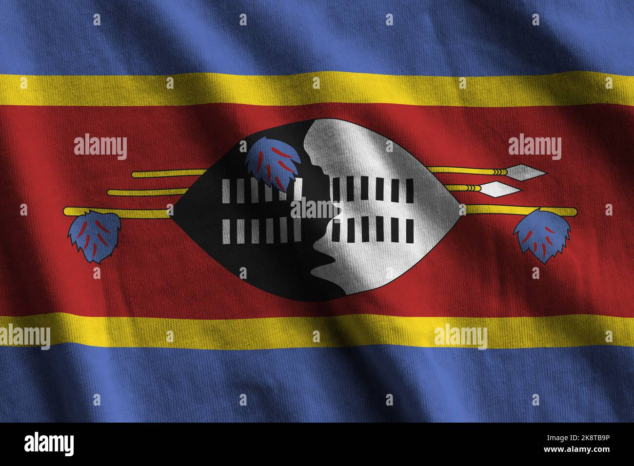 Swaziland flag with big folds waving close up under the studio light ...