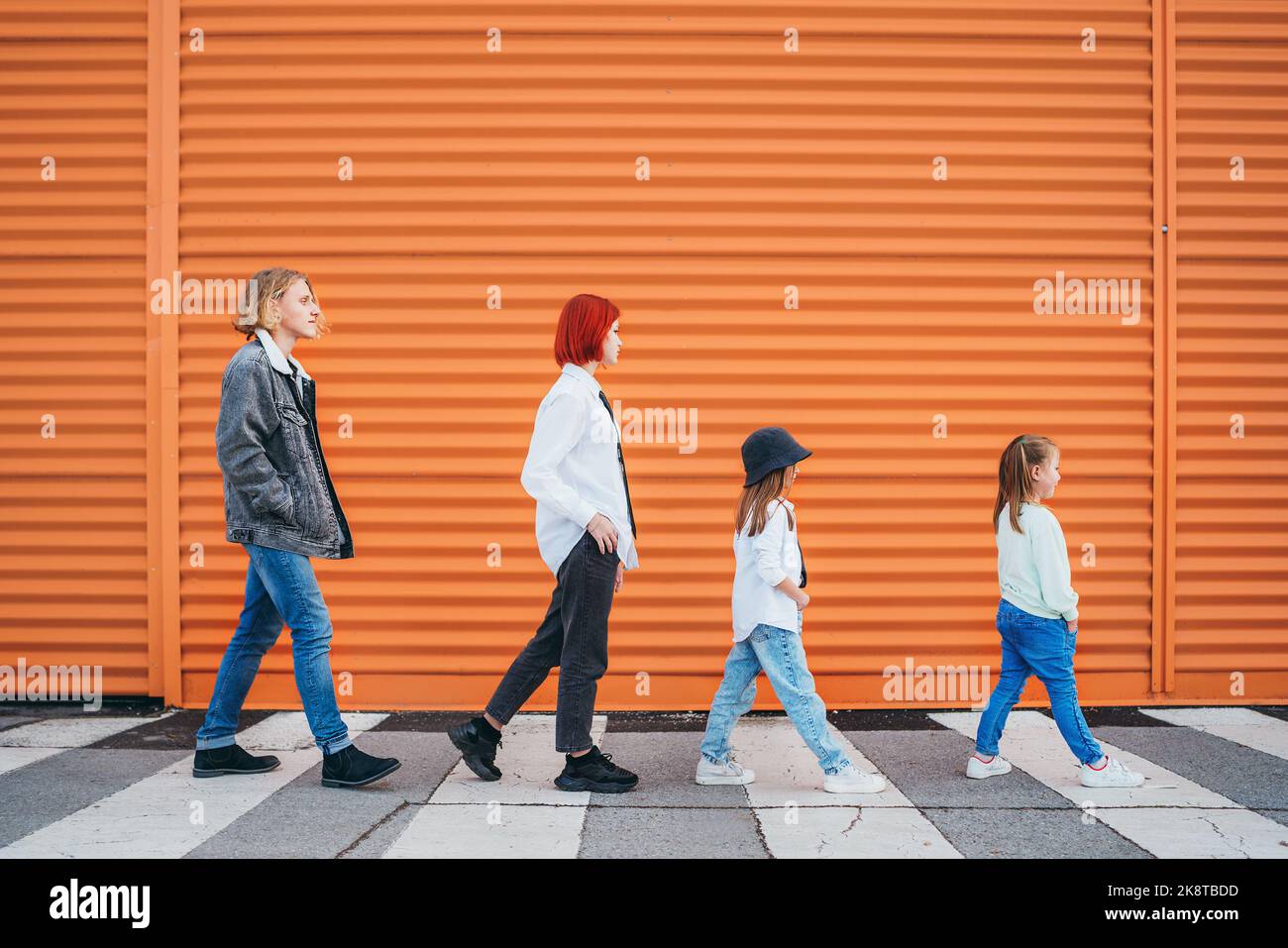 Fashion-dressed quartet of small kids and teenager sisters and brothers ...