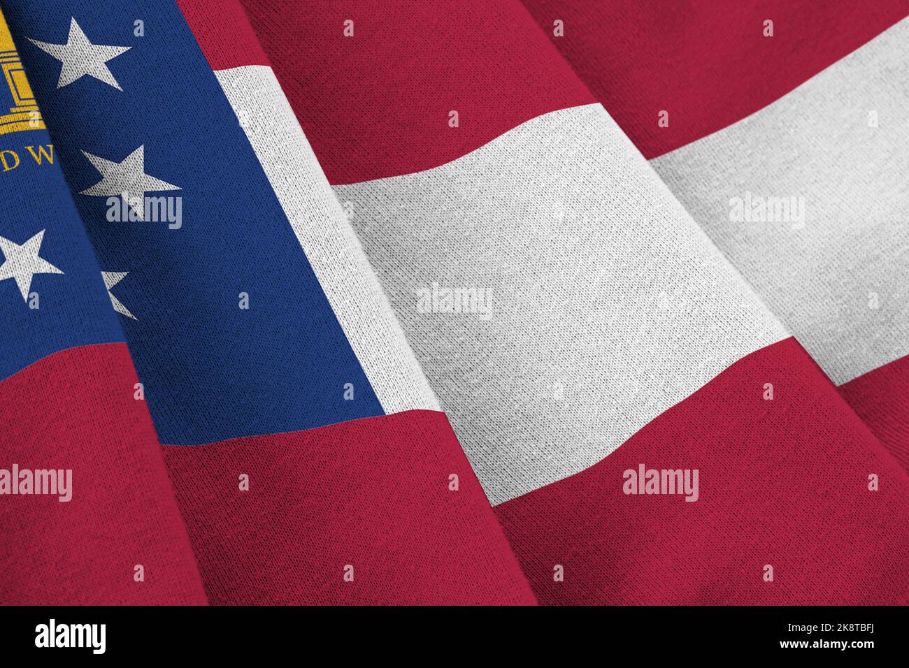 Georgia US state flag with big folds waving close up under the studio ...