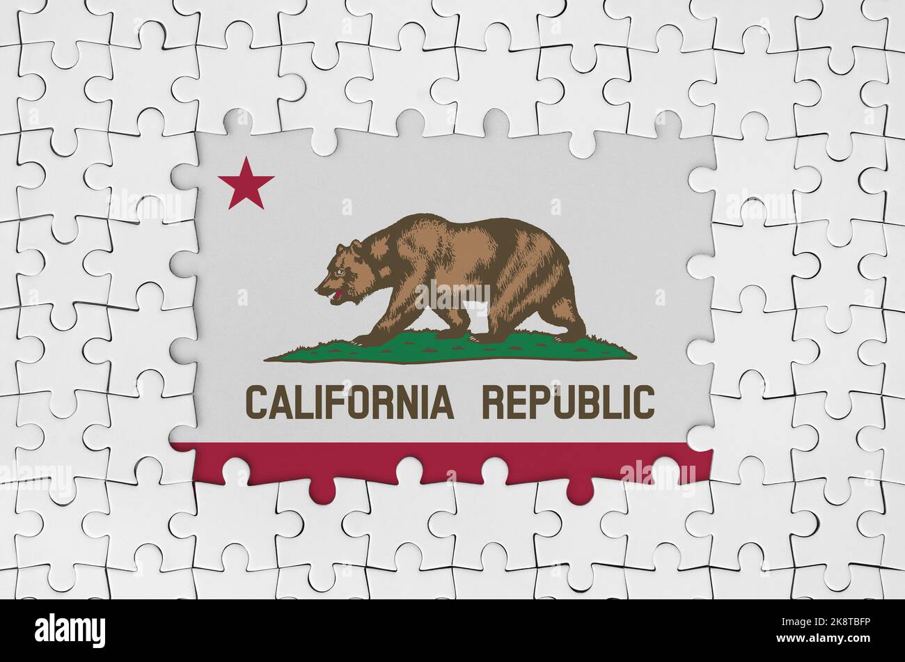 California US state flag in frame of white puzzle pieces with missing ...