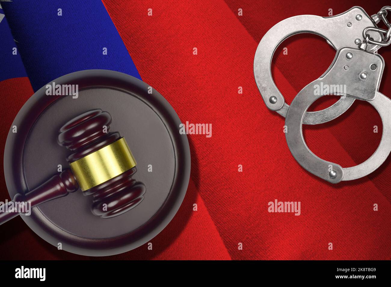 Taiwan flag with judge mallet and handcuffs in dark room. Concept of ...