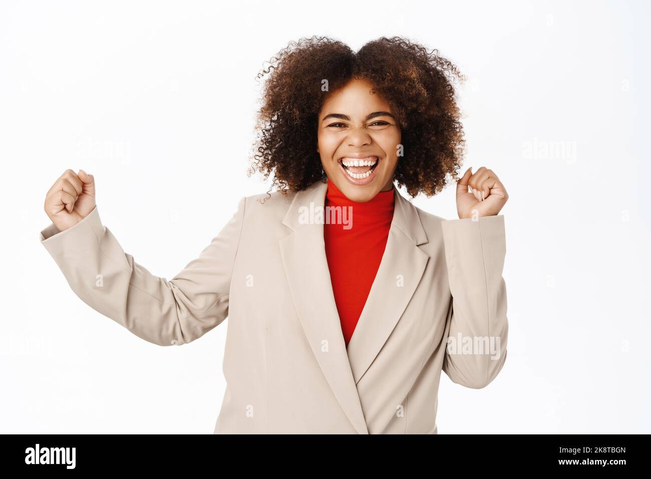 Happy african american businesswoman dancing in rejoice, celebrating ...