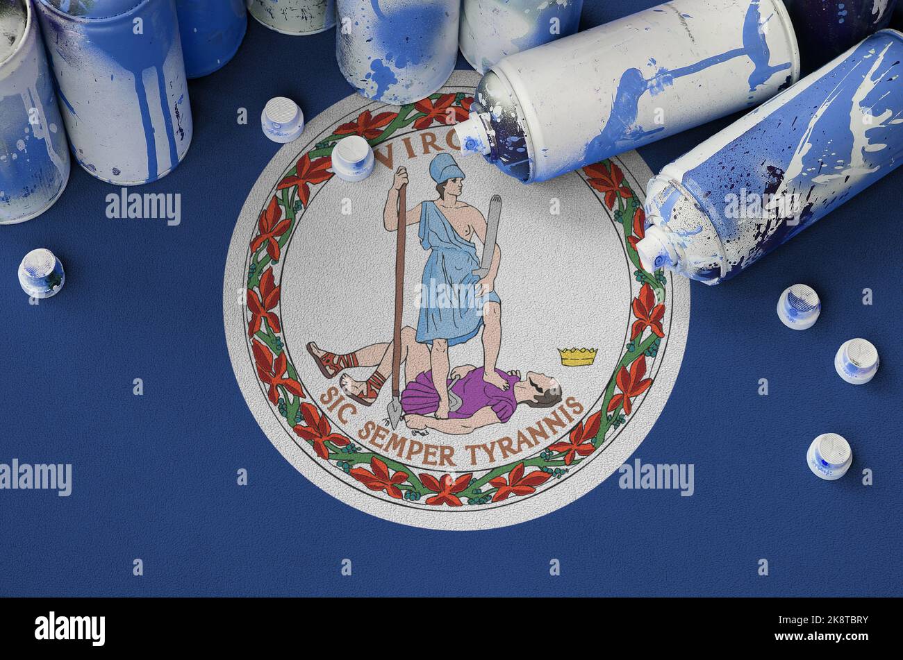 Virginia US state flag and few used aerosol spray cans for graffiti ...