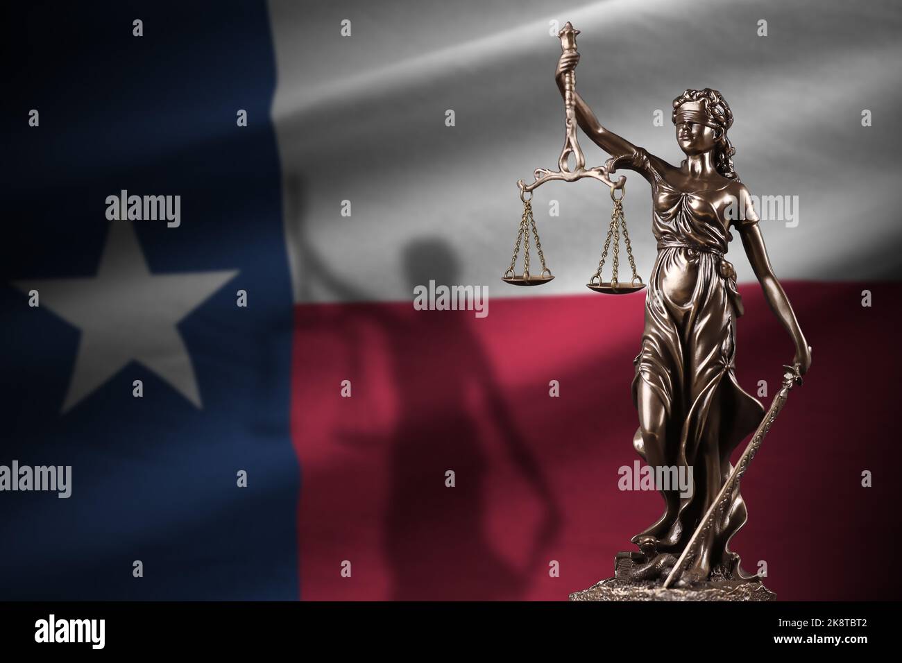 Texas US state flag with statue of lady justice and judicial scales in ...