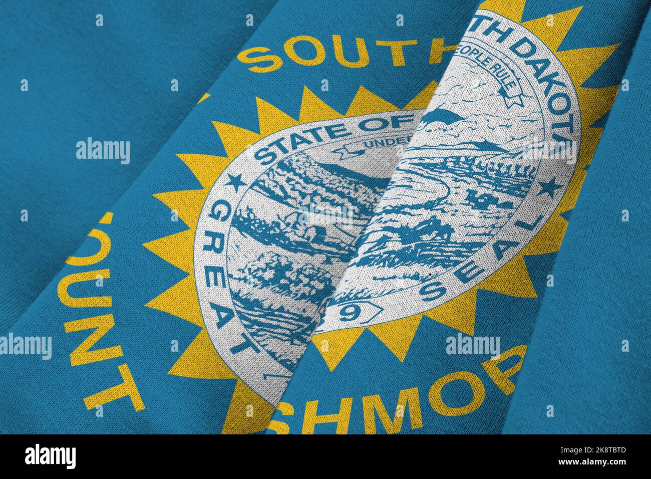 South Dakota US state flag with big folds waving close up under the ...