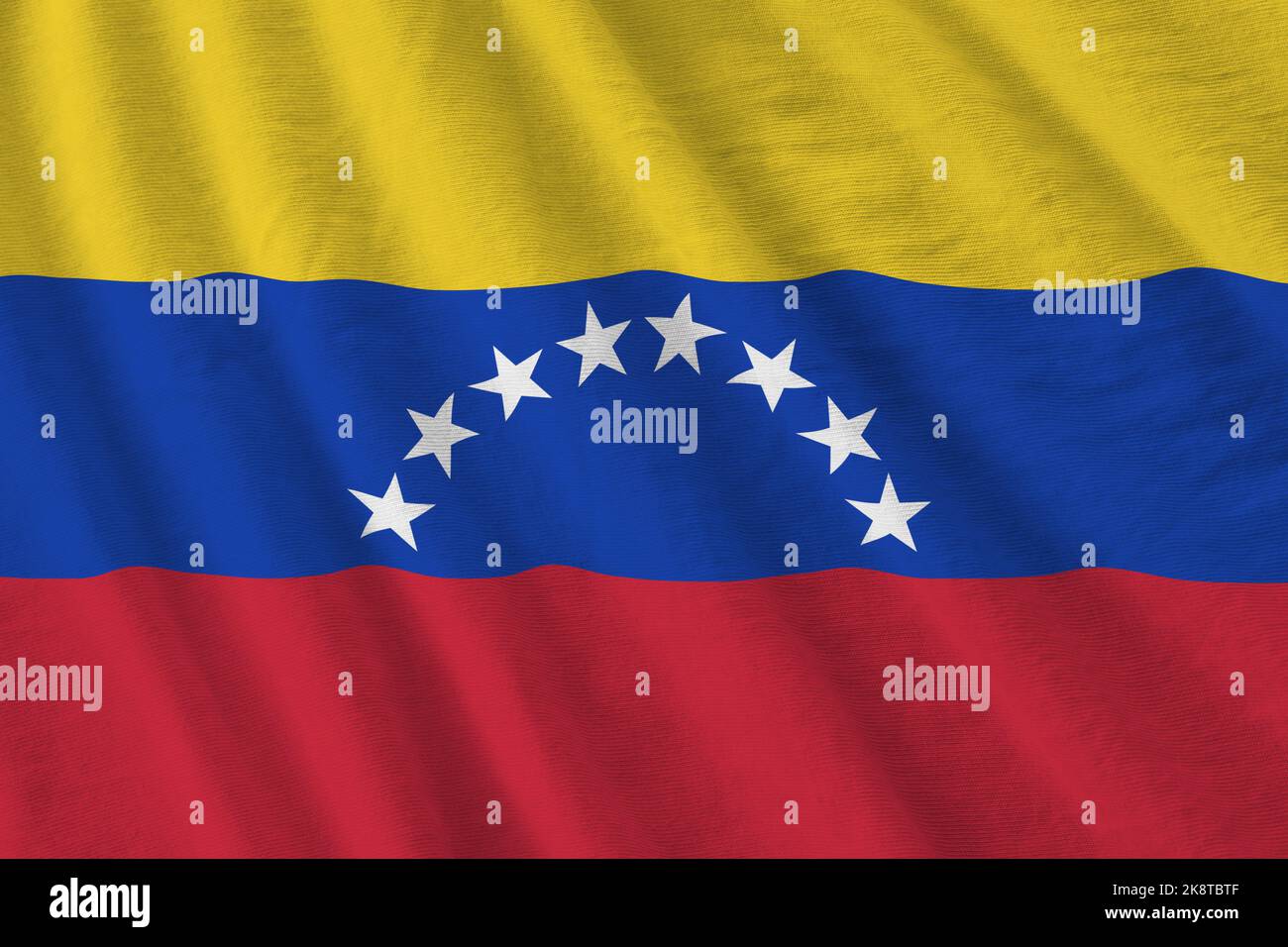 Venezuela flag with big folds waving close up under the studio light ...