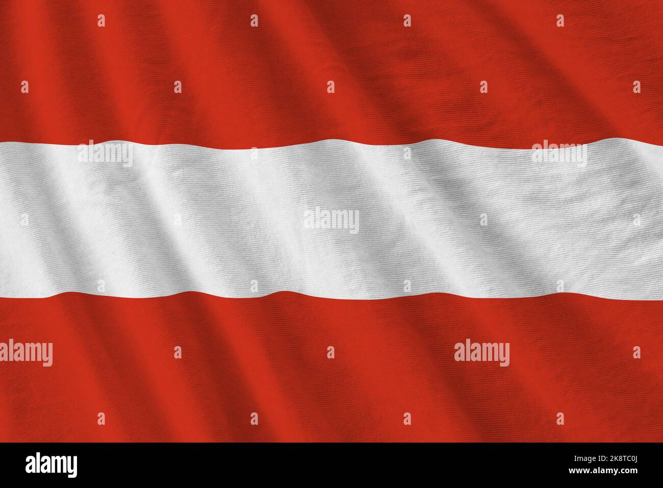 Austria flag with big folds waving close up under the studio light ...