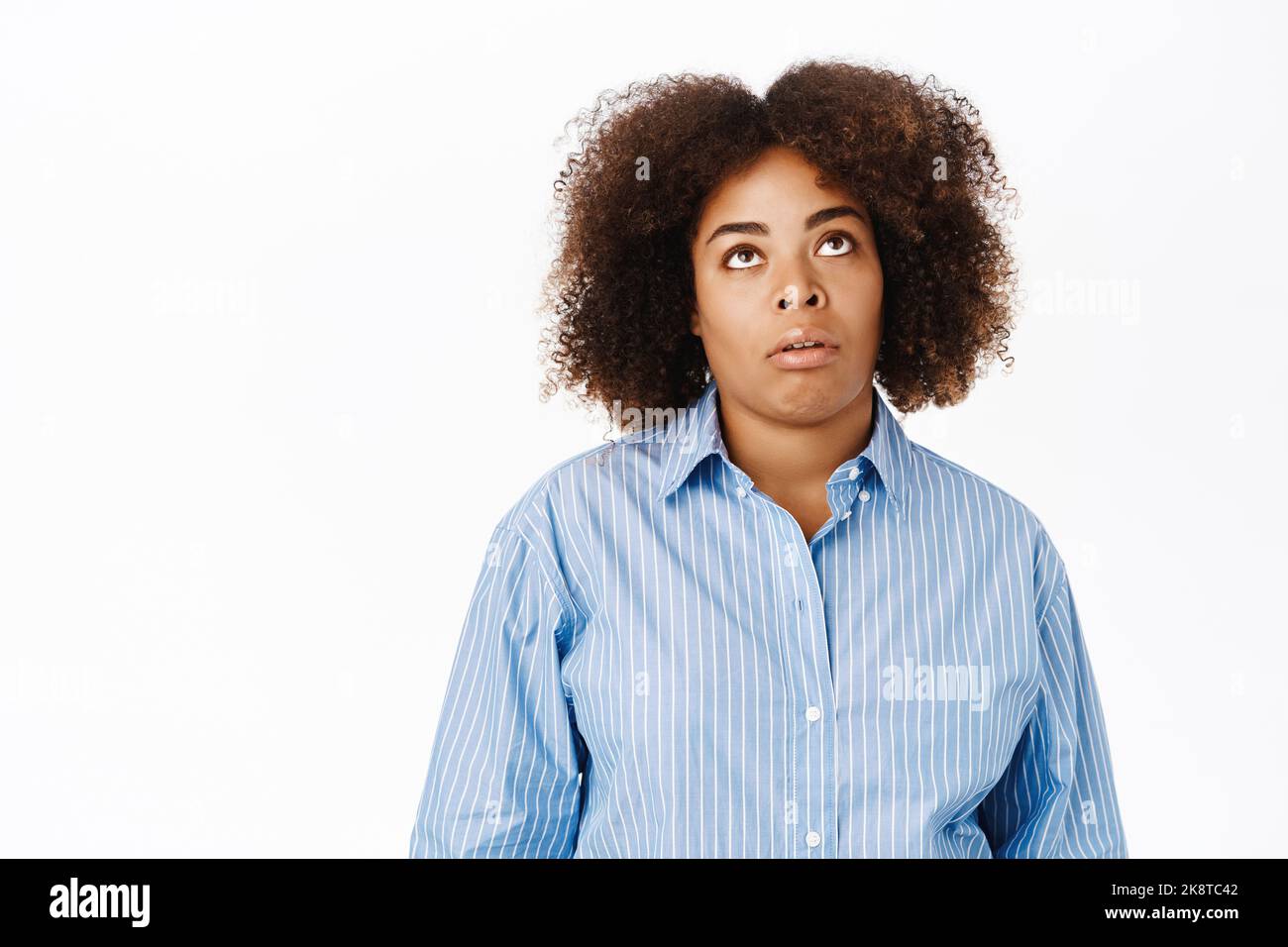 Portrait of african american woman roll eyes from boredom, looking ...