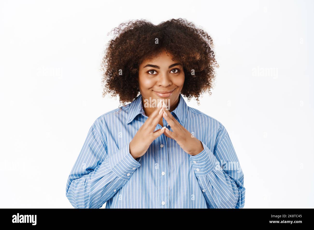 Image of young african american woman looks thoughtful and pleased ...