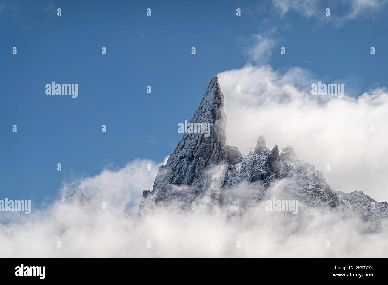 The mountain peak of Dent du Geant emerging in profile from the cloud ...