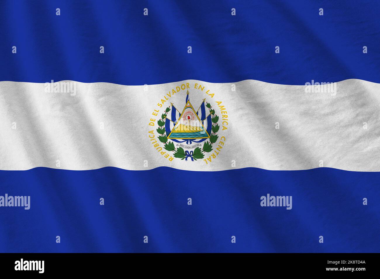 El Salvador flag with big folds waving close up under the studio light ...