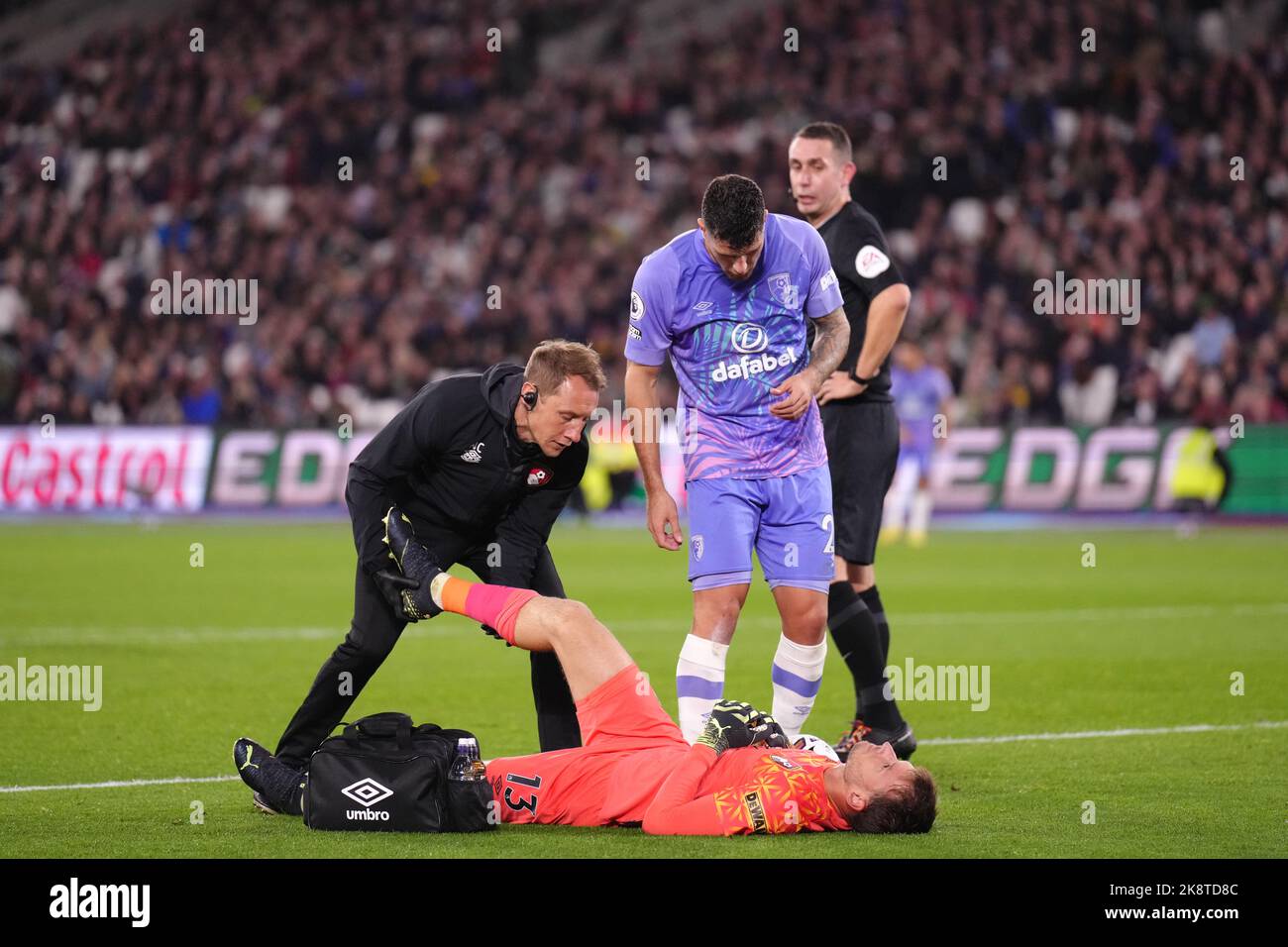 Bournemouth goalkeeper Neto receives treament for an injury during the ...