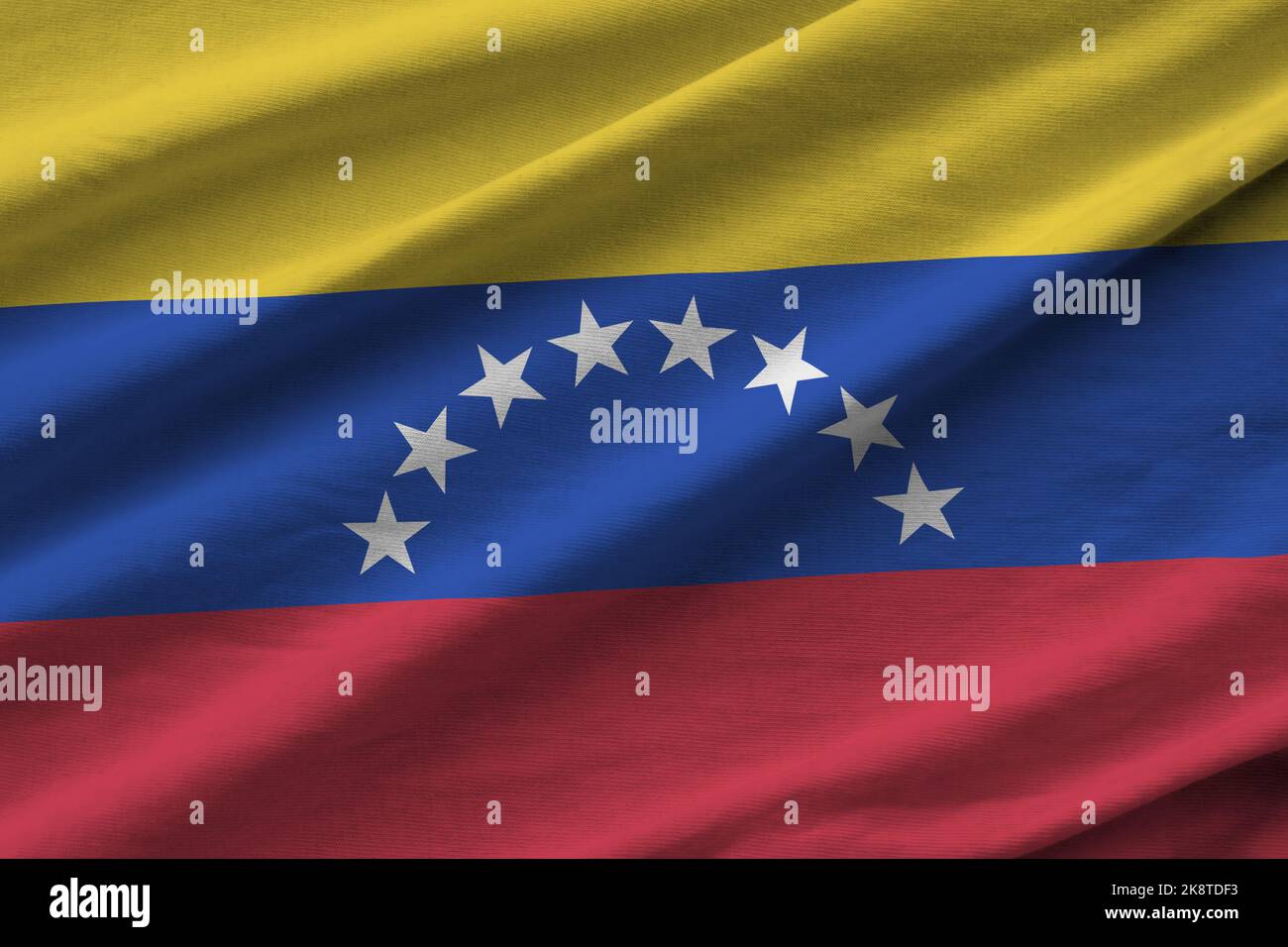 Venezuela flag with big folds waving close up under the studio light ...