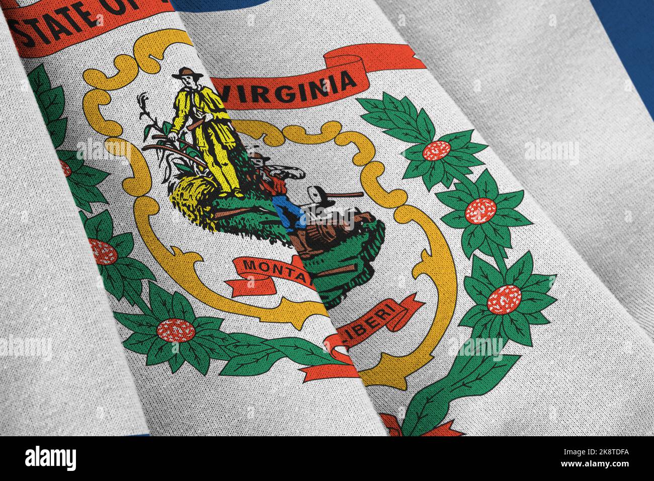 West Virginia US state flag with big folds waving close up under the ...
