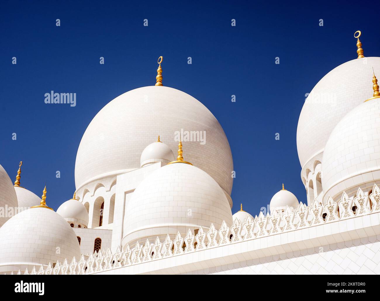 A beautiful view of the Sheikh Zayed Grand Mosque with a blue sky ...