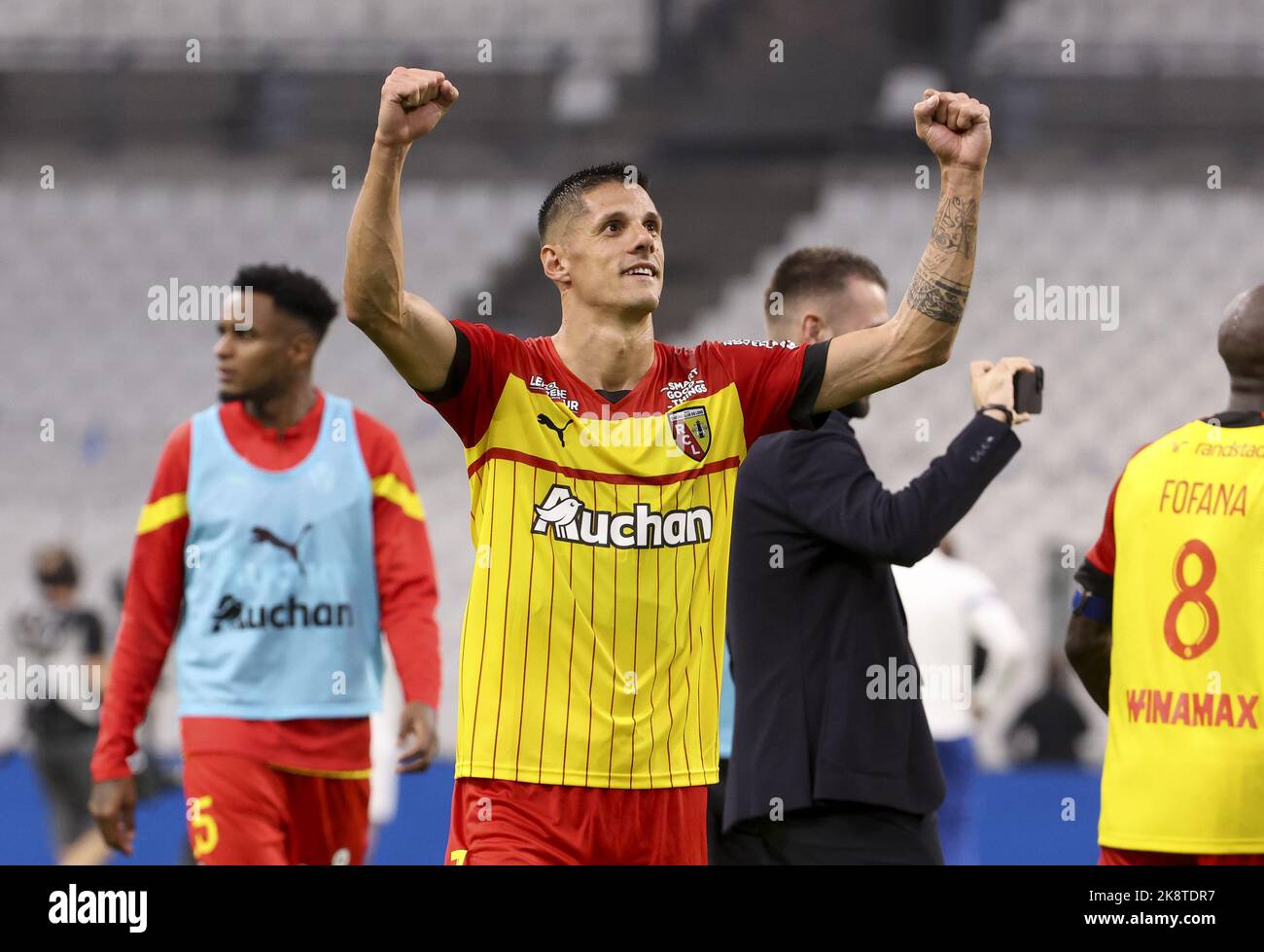 Florian Sotoca of Lens celebrates the victory following the French ...