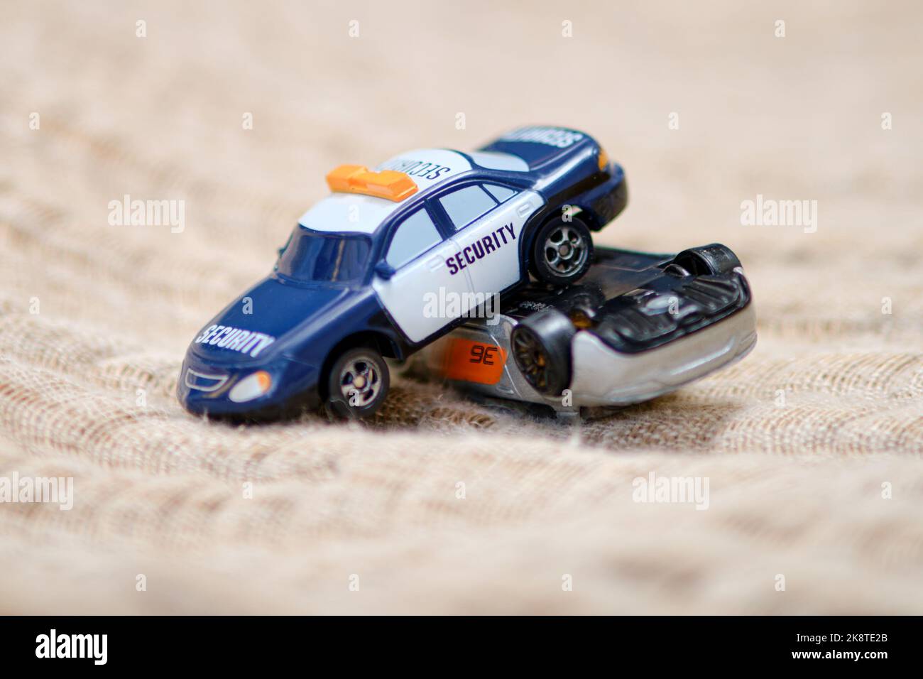 A toy police car on the floor in the children s room, close-up accident ...