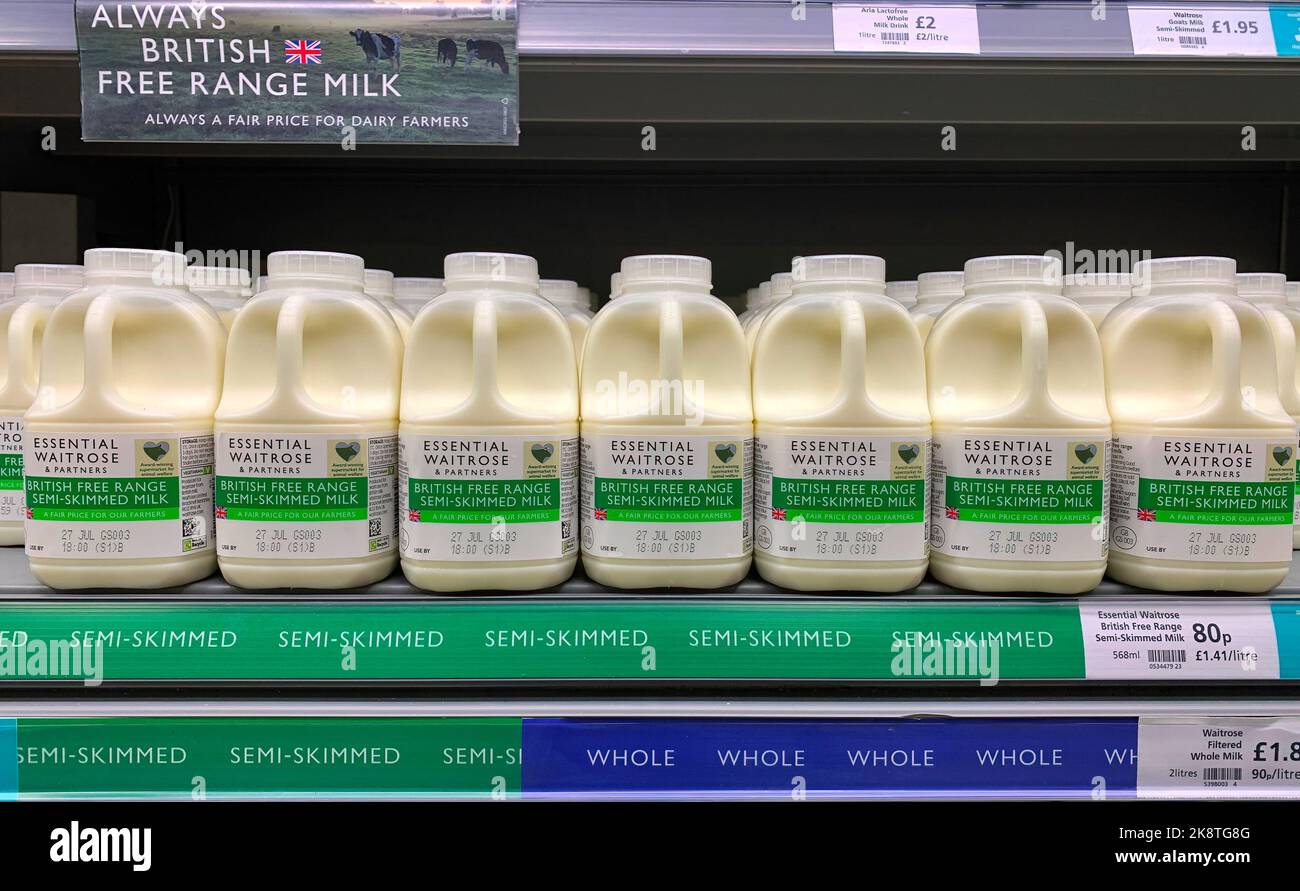 A row of British free range semi-skimmed milk in plastic bottles on ...