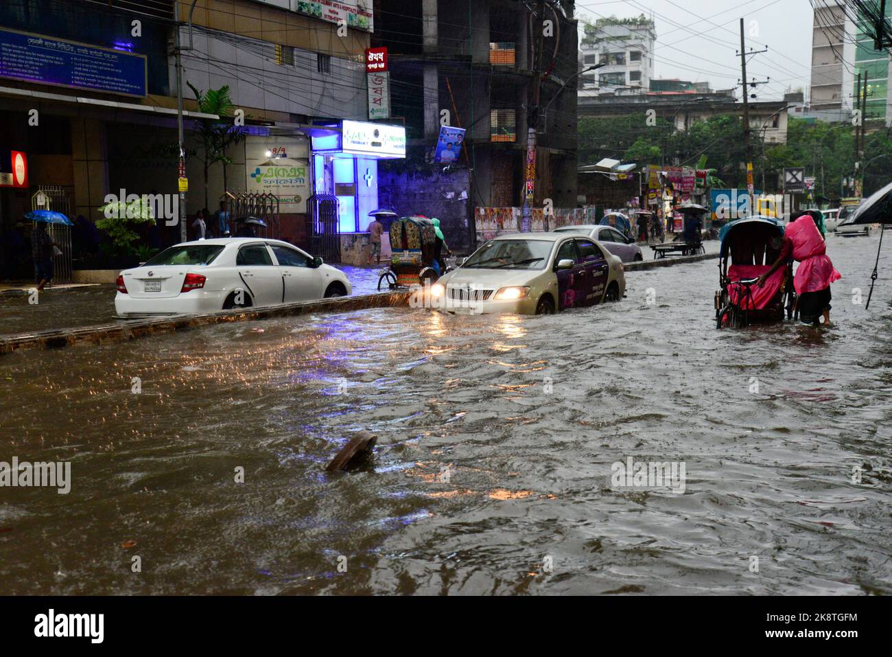 Dhaka, Bangladesh, on October 24, 2022. Vehicles and Rickshaws try ...