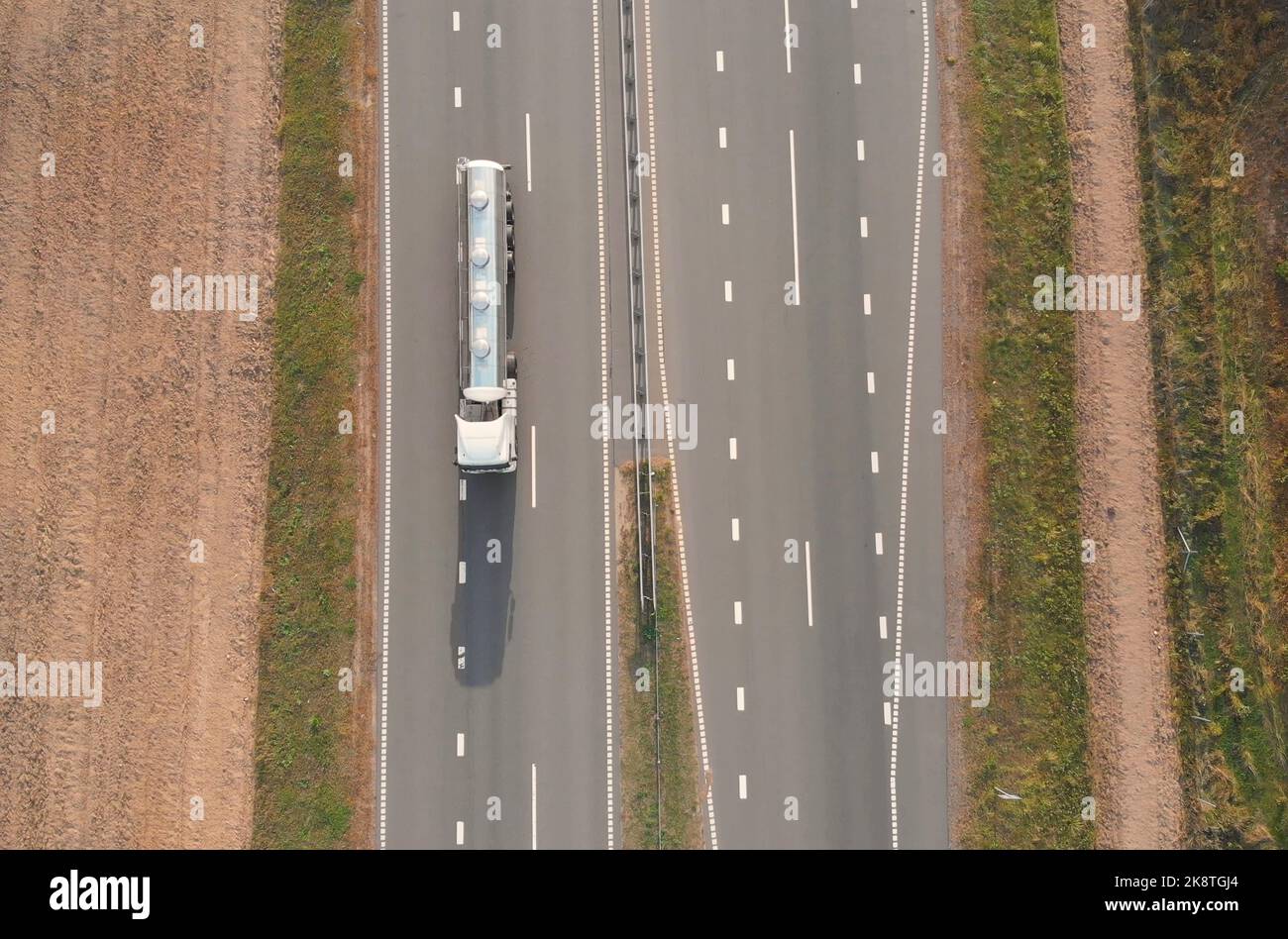 Transport logistics. Top view of a tanker truck that moves along an ...