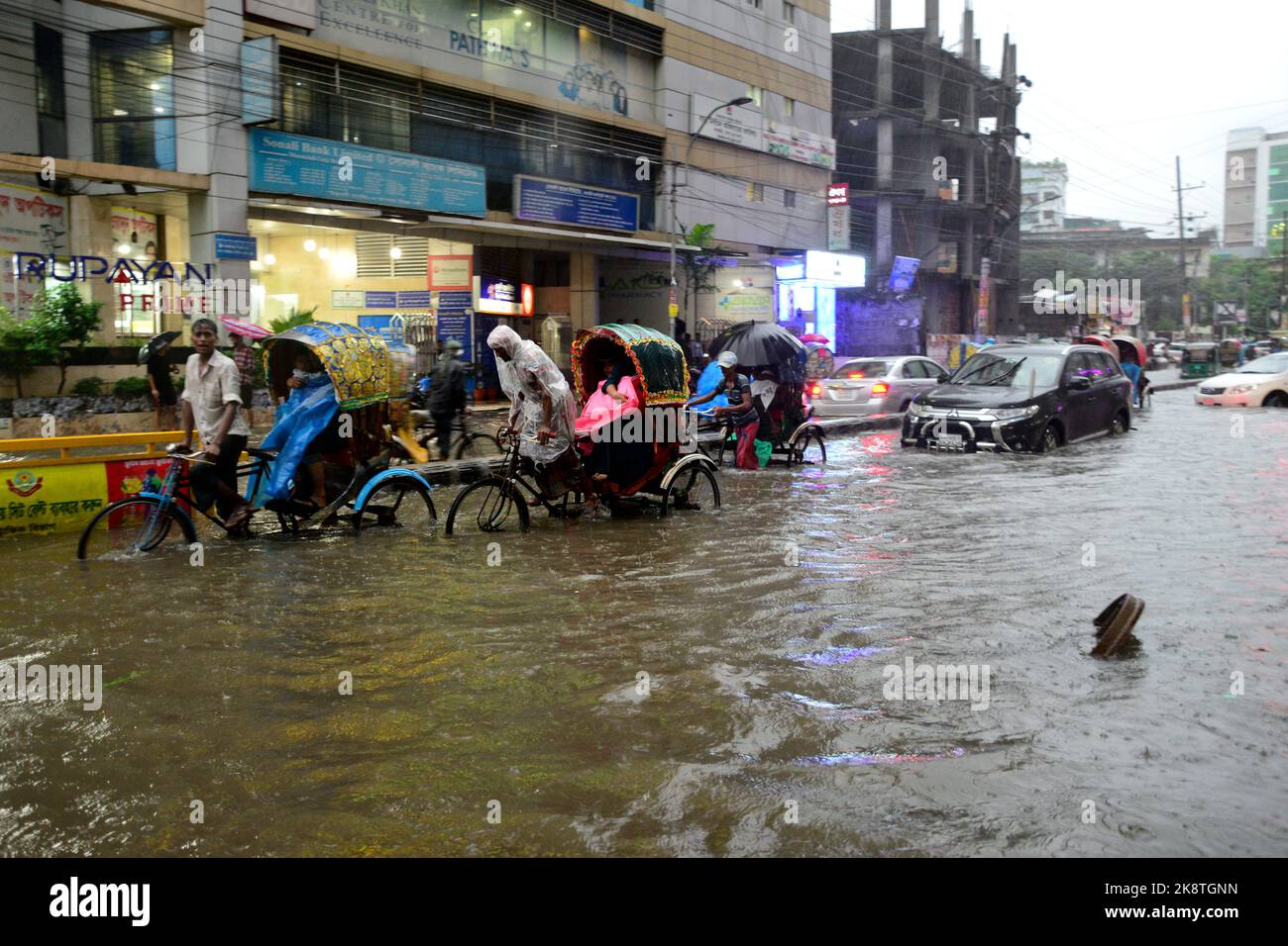 Dhaka, Bangladesh, on October 24, 2022. Vehicles and Rickshaws try ...