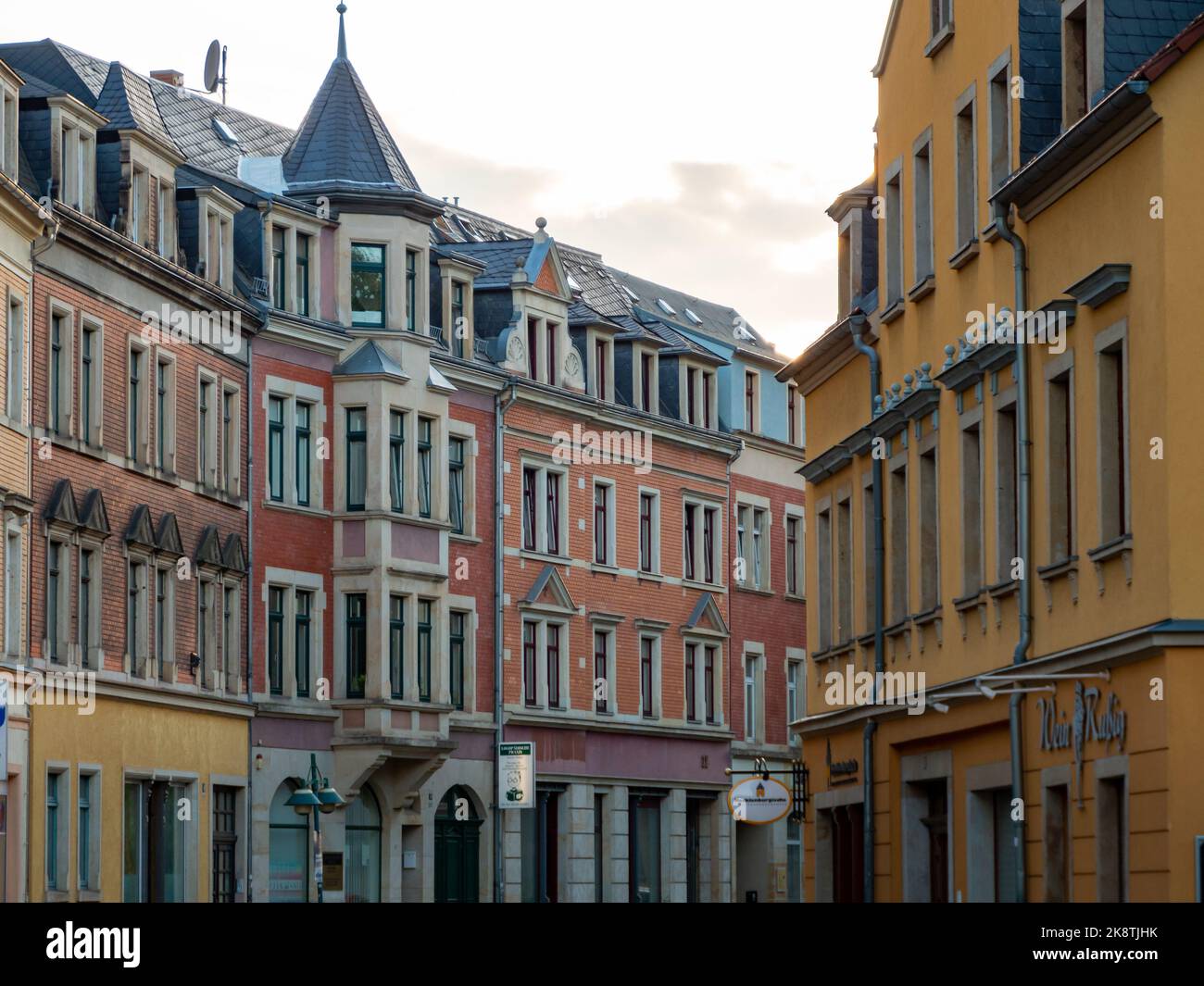 Facades of old buildings in the town. Renovated exterior walls with ...