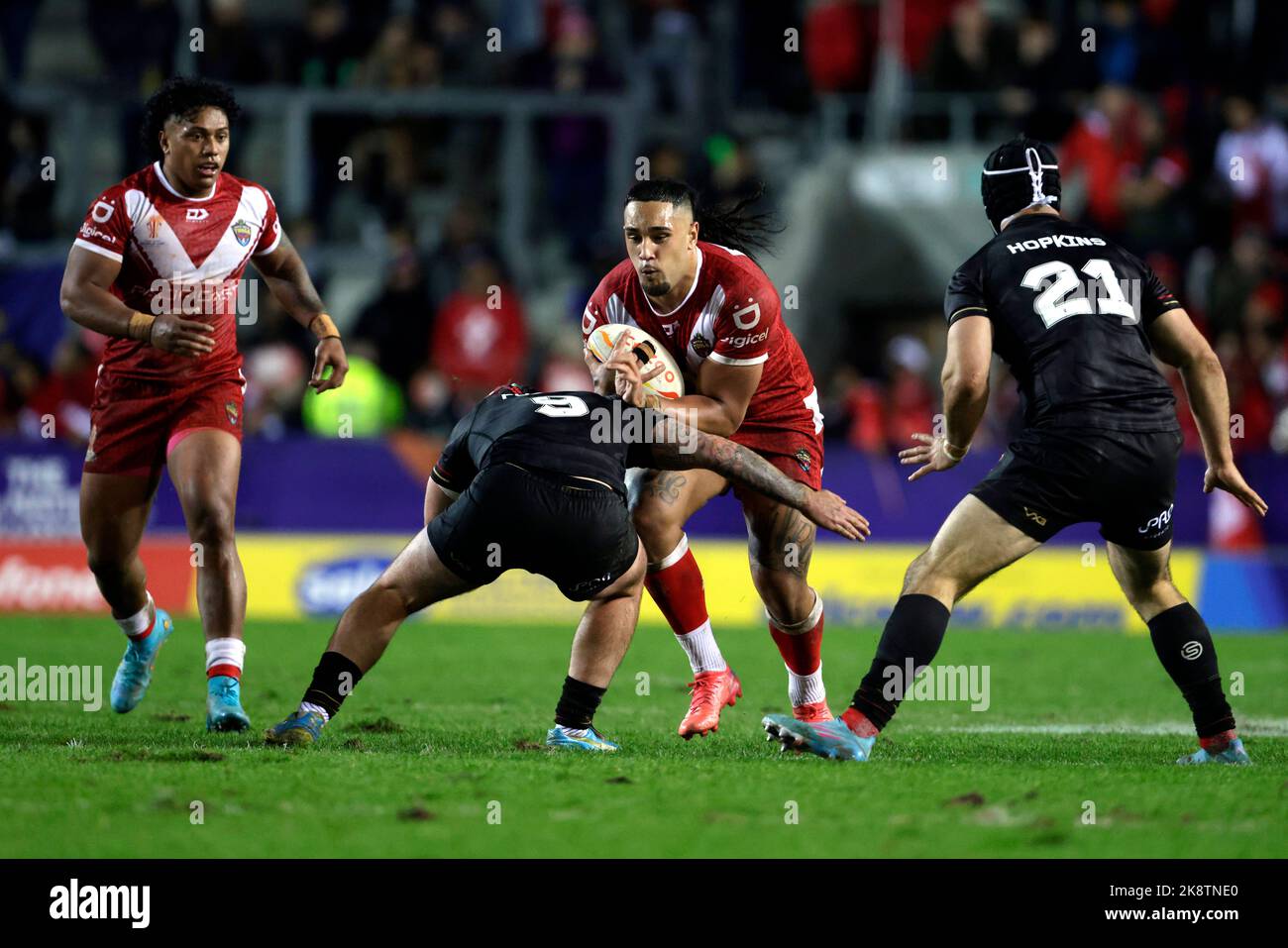 Tonga's Keaon Koloamatangi is tackled by Wales' Matthew Fozard during ...
