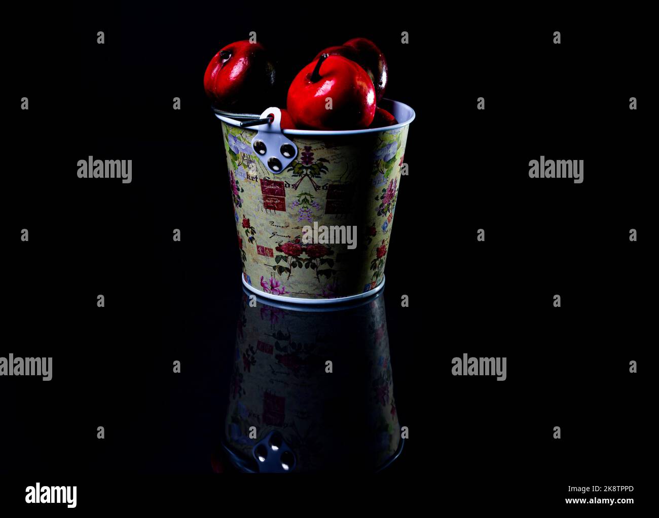 aluminum ice bucket laid in wait for use. stainless multi-colored ...