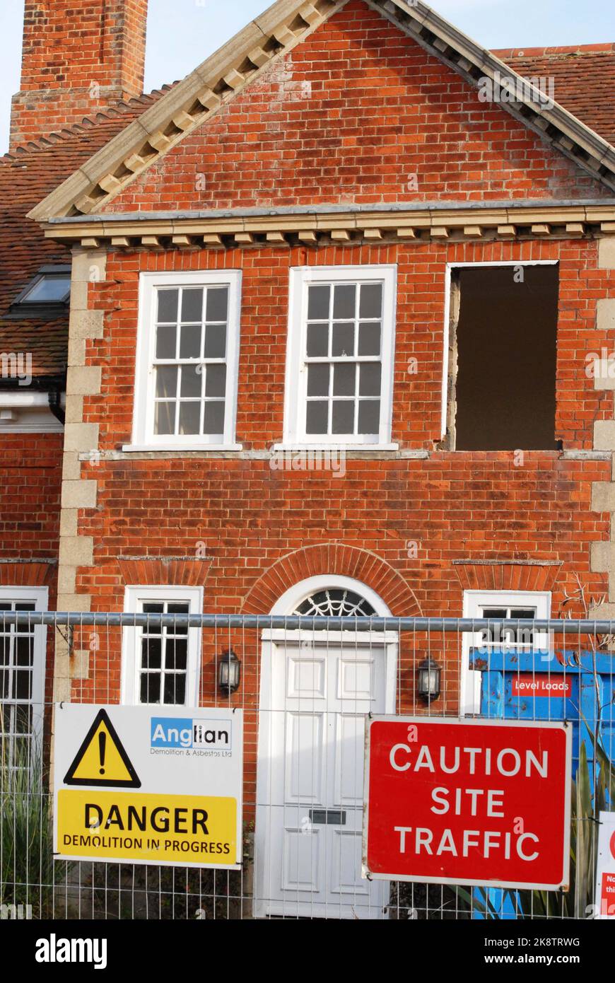 Caution Site, Danger Demolition signs and missing window at site of ...