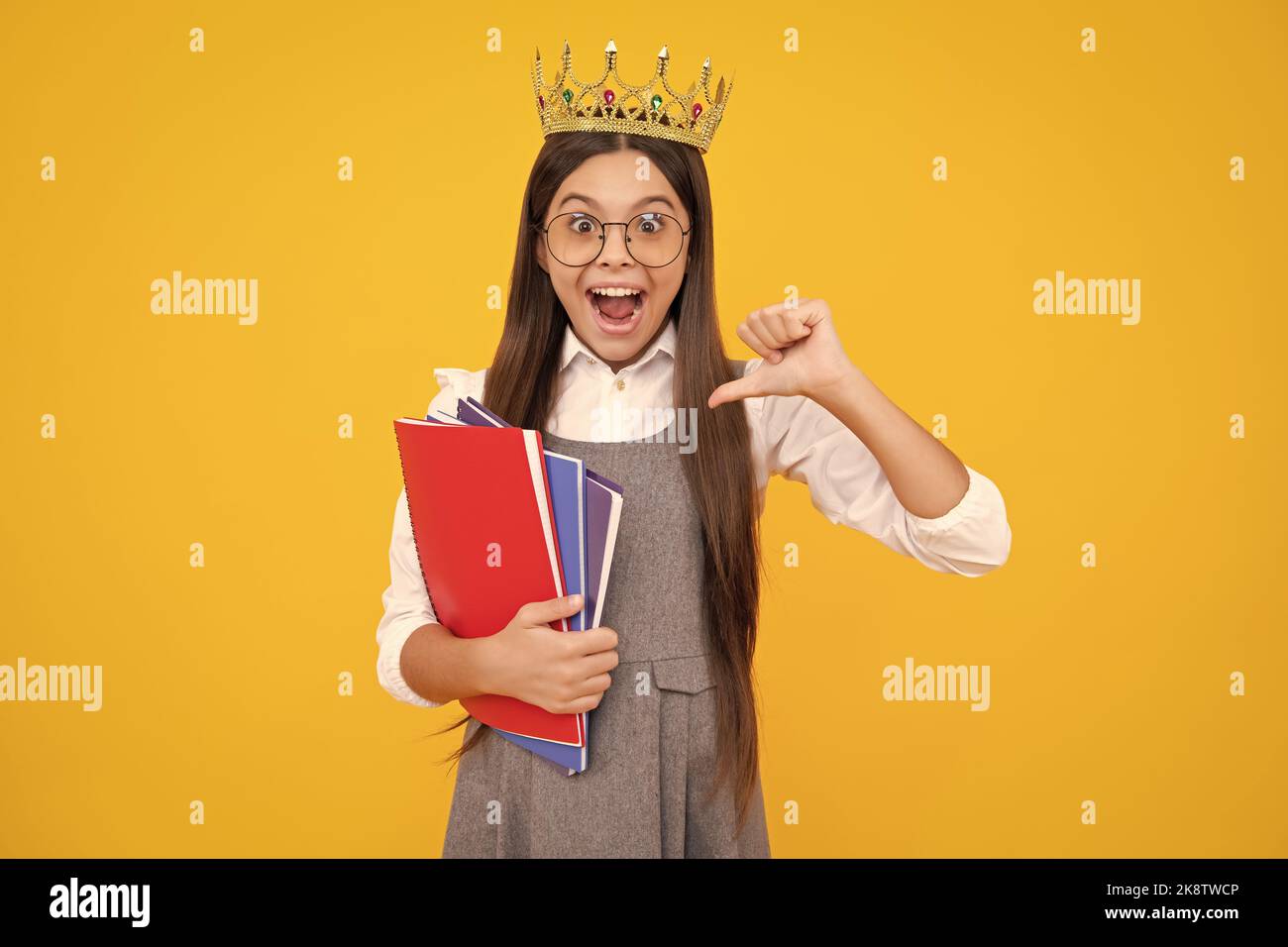Excited teenager princess in school uniform and crown celebrating ...